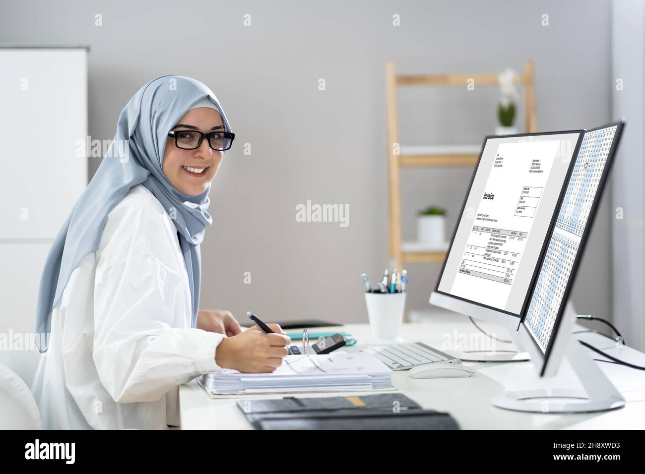 Business Tax And Invoice Audit Using Office Computer Stock Photo - Alamy