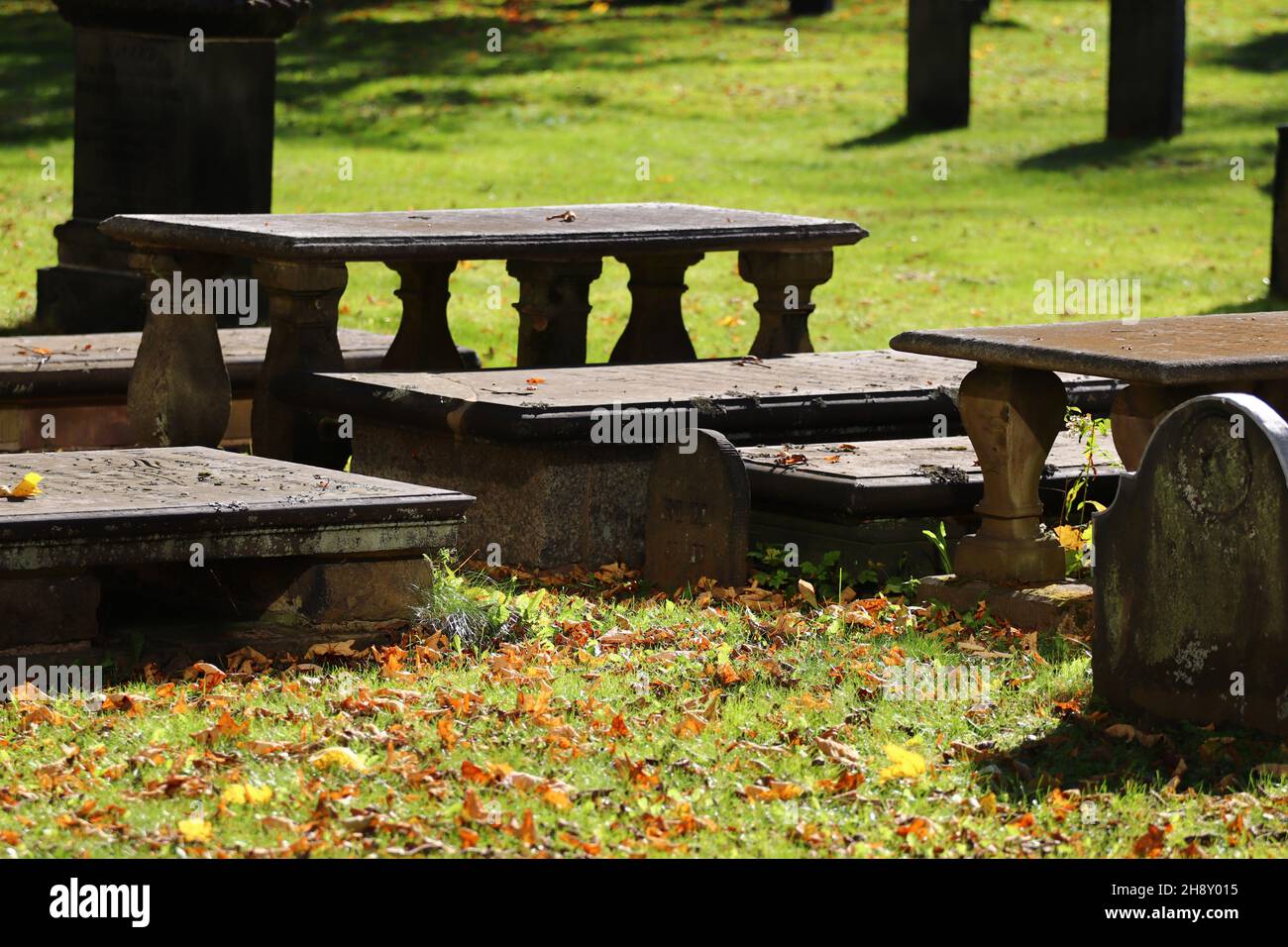 Graves and stone tables in the park Stock Photo - Alamy