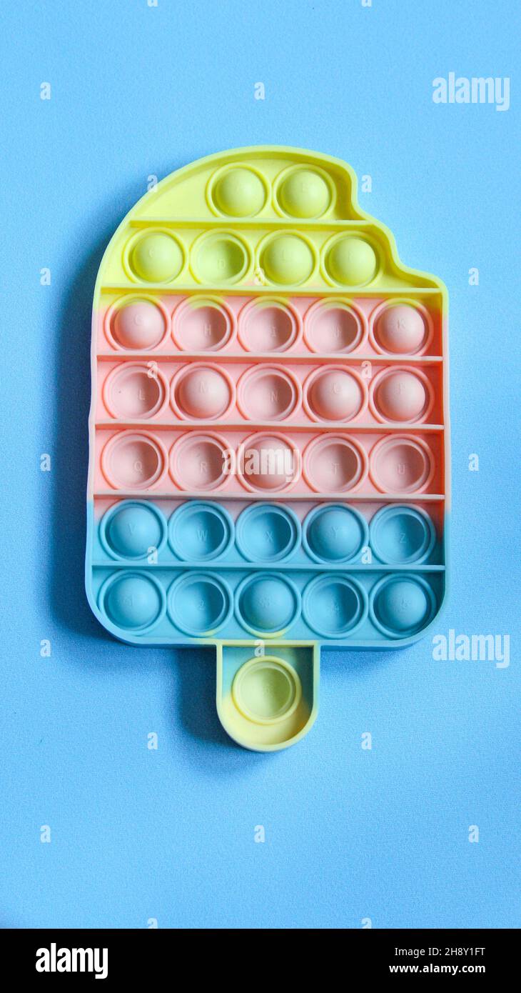 Pop it sensory toy from soft silicone bubbles. Stress and anxiety ...