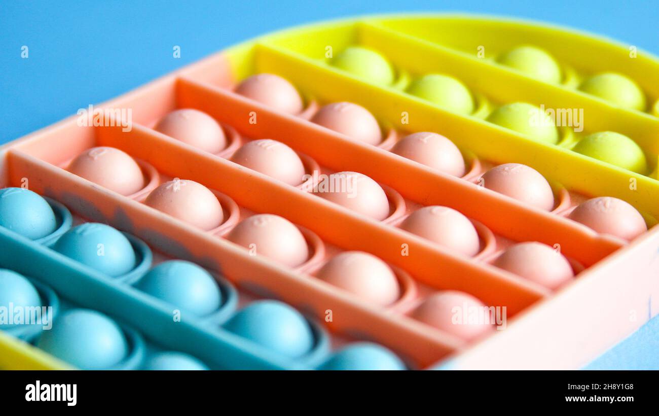 Pop it sensory toy from soft silicone bubbles. Stress and anxiety ...