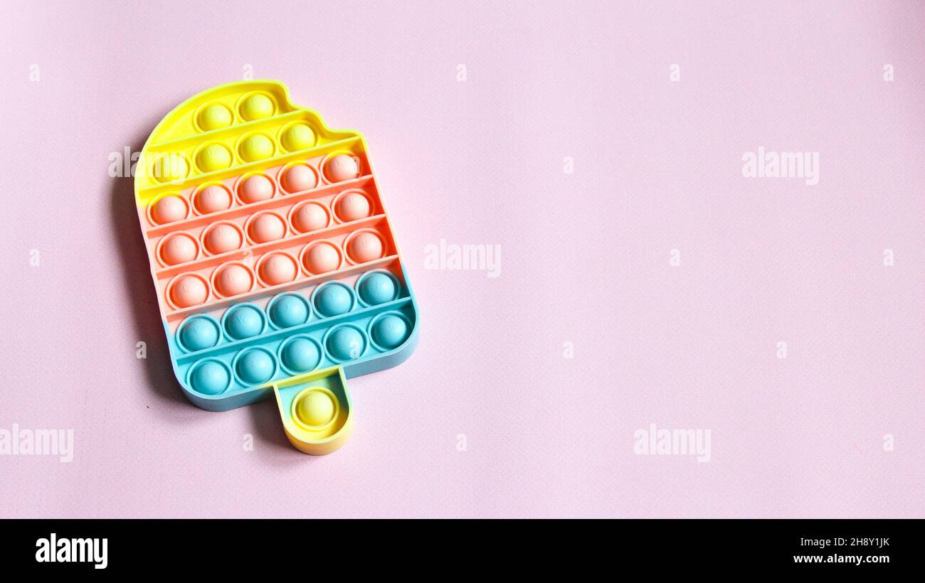 Pop it sensory toy from soft silicone bubbles. Stress and anxiety ...