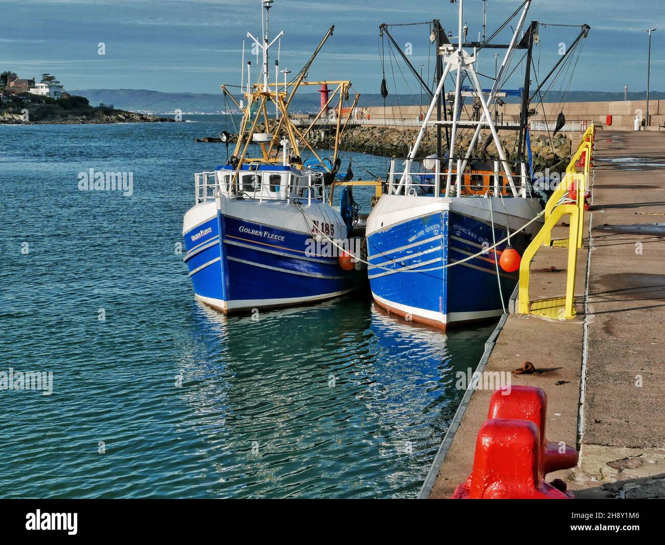 Fishing boats tied up together in Bangor harbour Stock Photo - Alamy