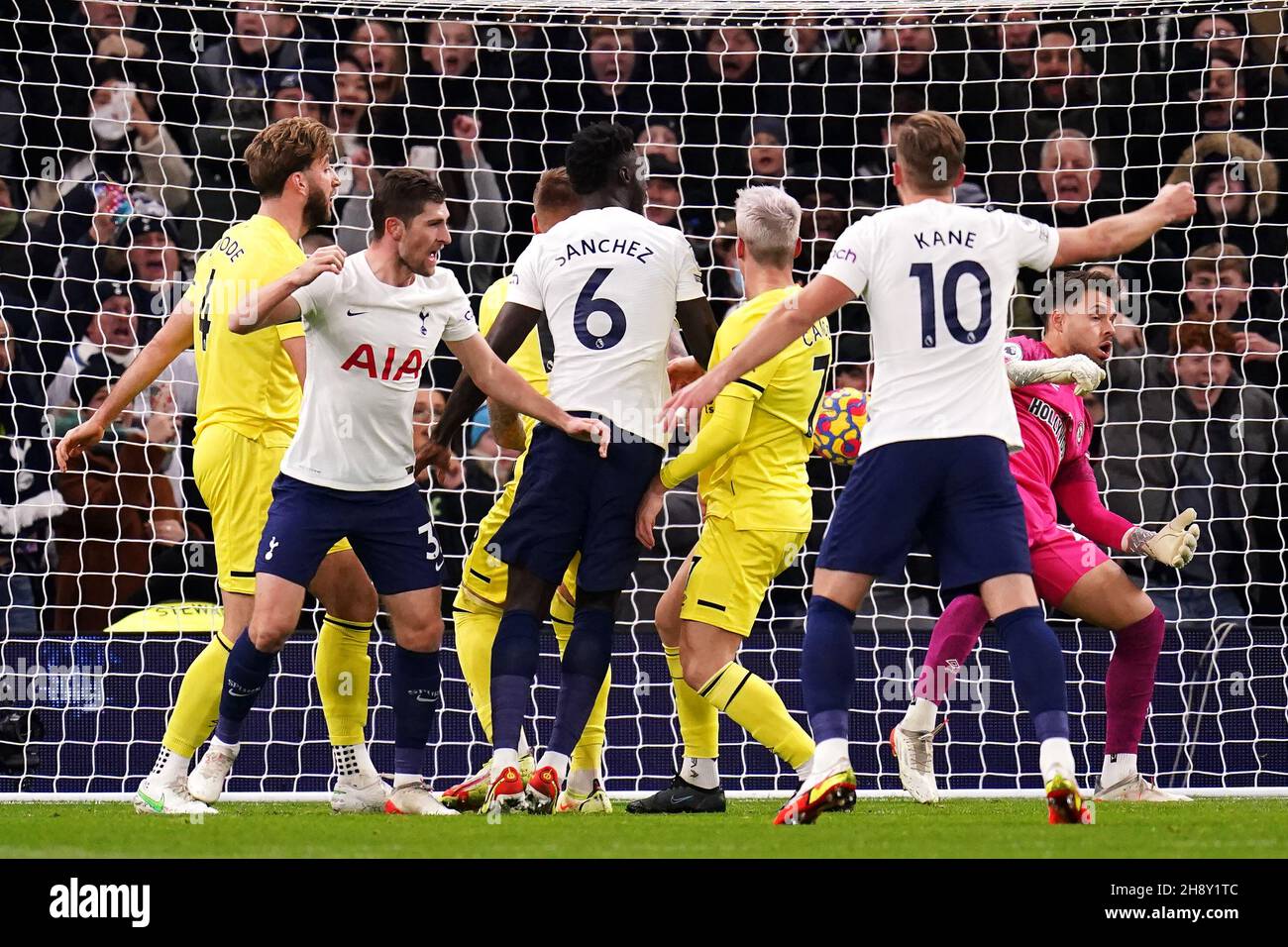 Tottenham Hotspur players celebrate their side's first goal of the game ...