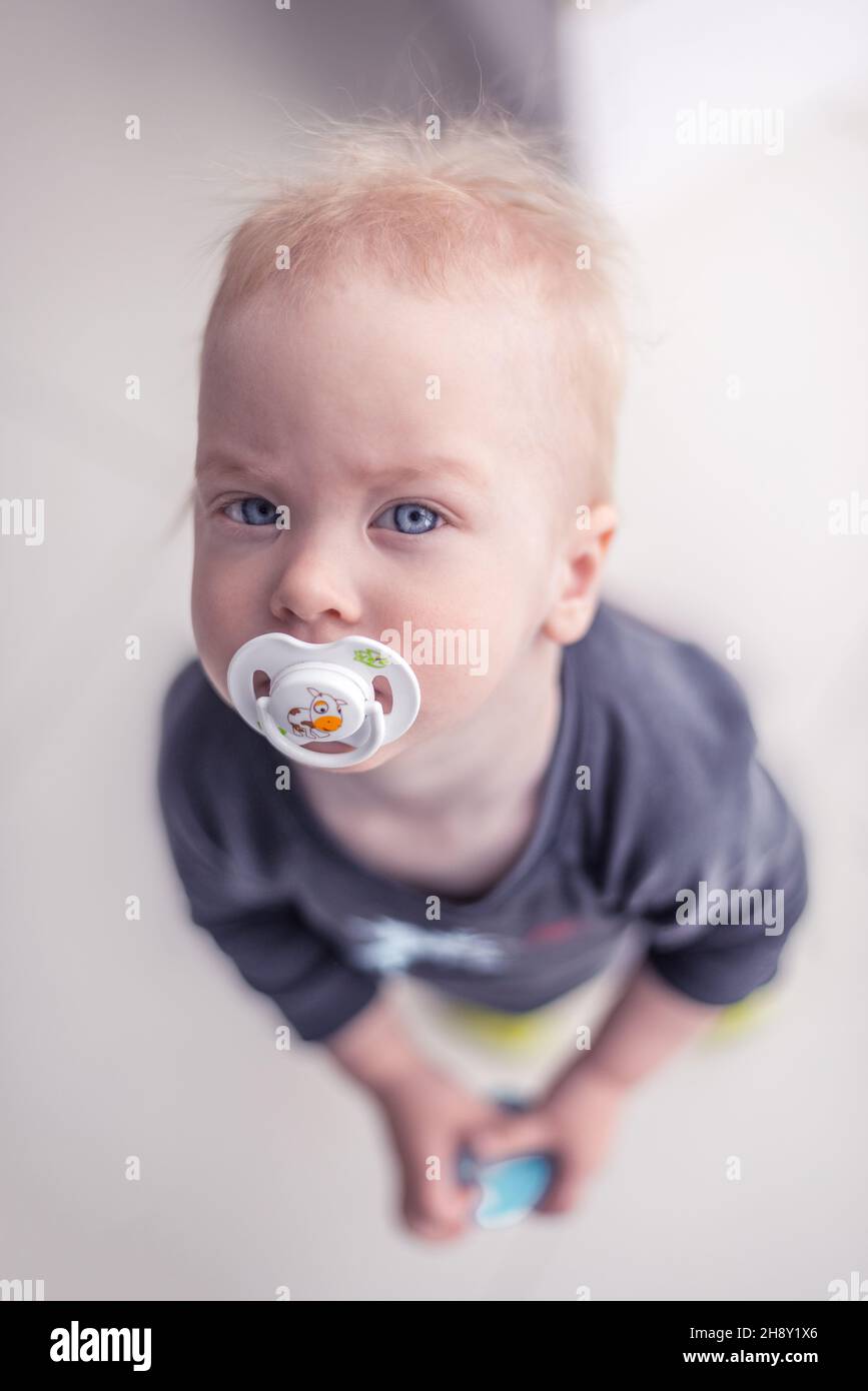 sweet baby girl with soother Stock Photo - Alamy
