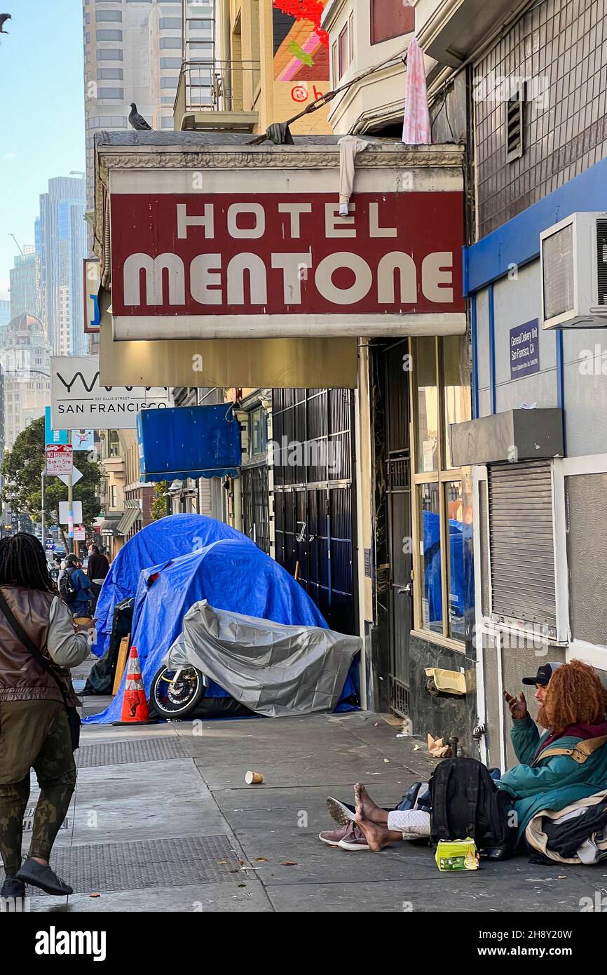Unhoused people are seen in and around the streets of the Tenderloin ...