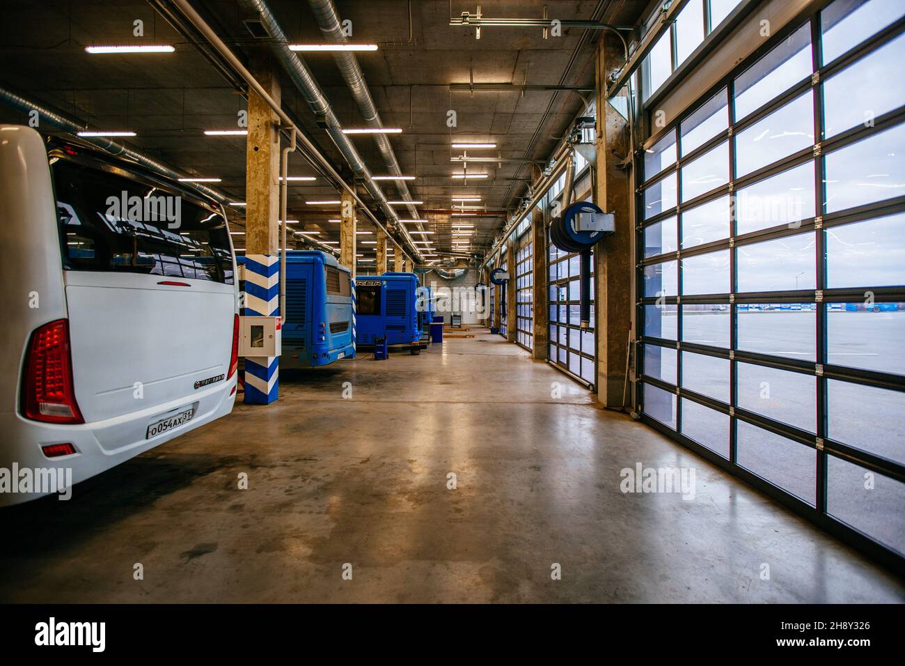 Buses in the modern repair service workshop Stock Photo - Alamy