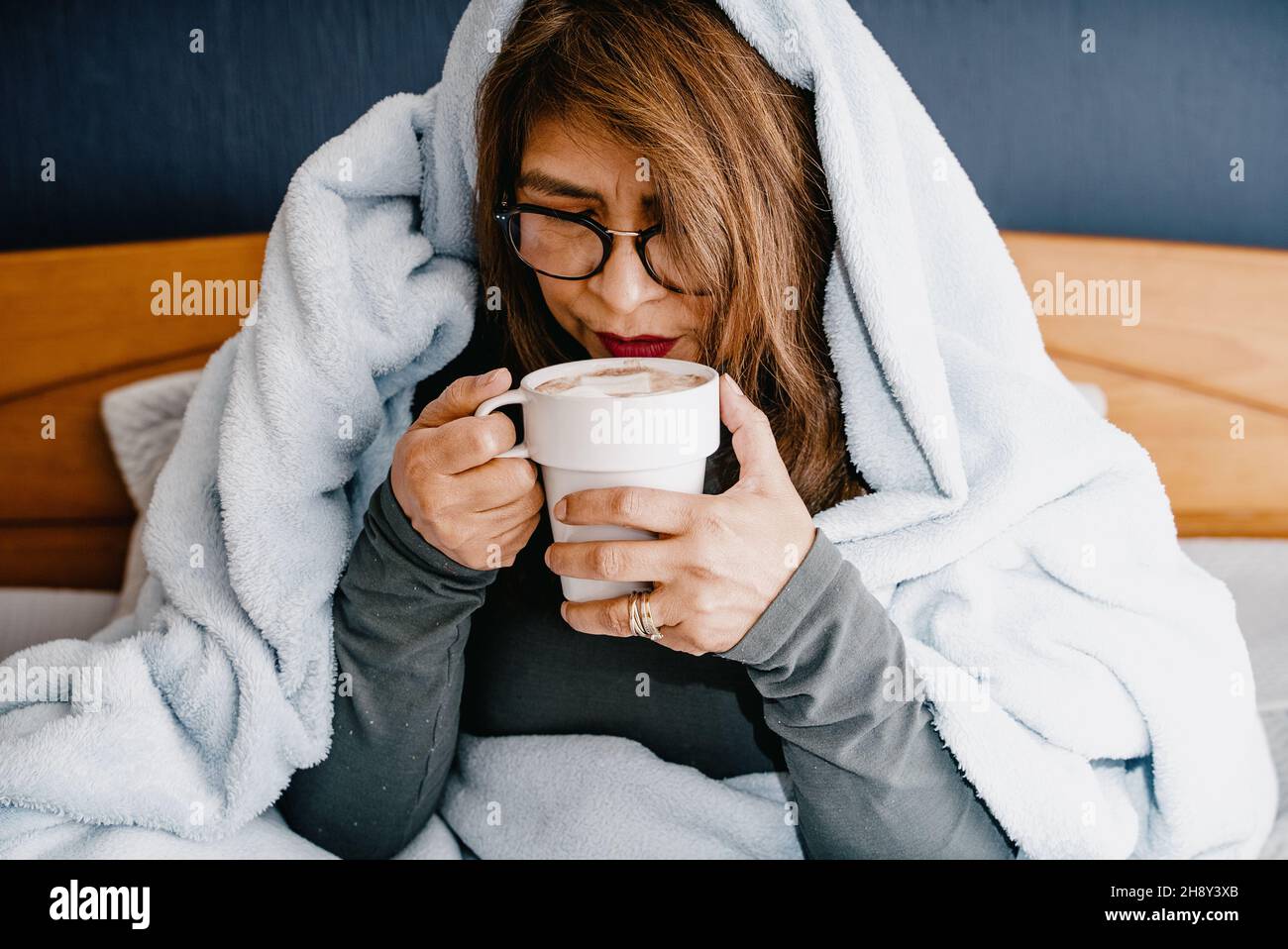 Woman drinking hot chocolate hi-res stock photography and images - Alamy