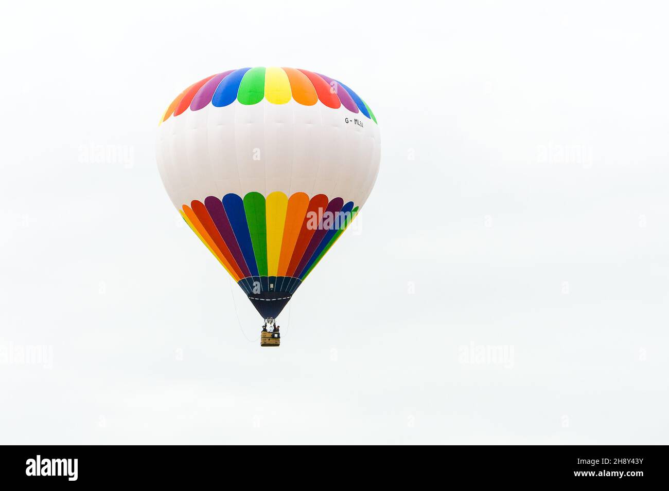 Colorful air balloon floating in the air on a white background Stock ...