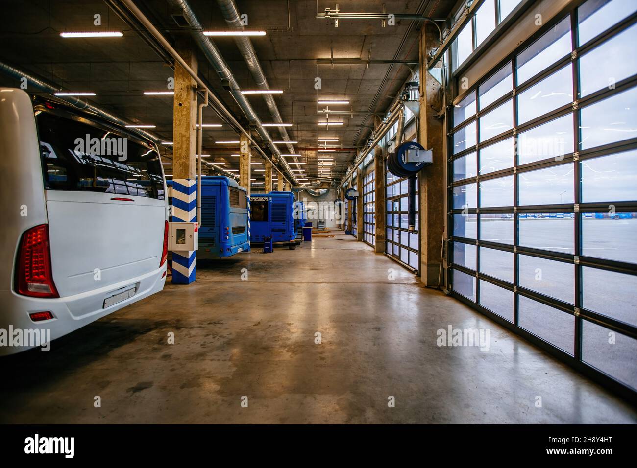 Buses in the modern repair service workshop Stock Photo - Alamy