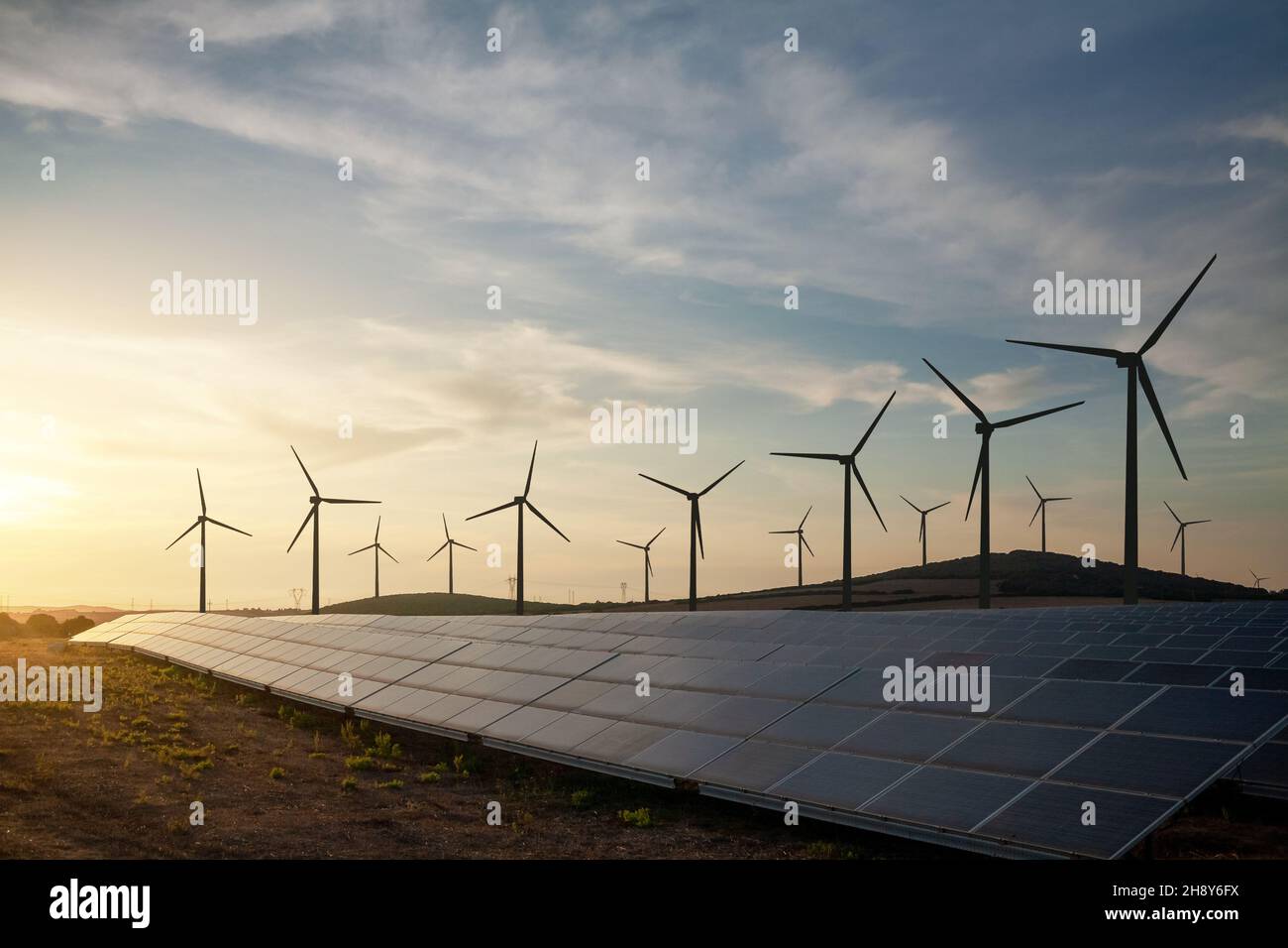 Solar panels and wind turbines generating renewable energy for green ...