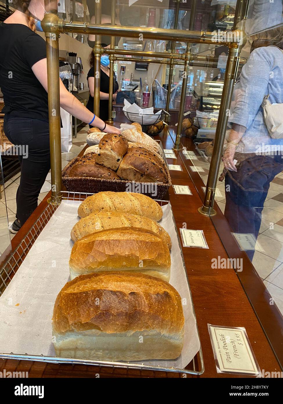 Fresh baked bread on display in bakery Stock Photo - Alamy