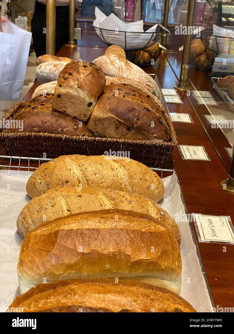 Fresh baked bread on display in bakery Stock Photo - Alamy
