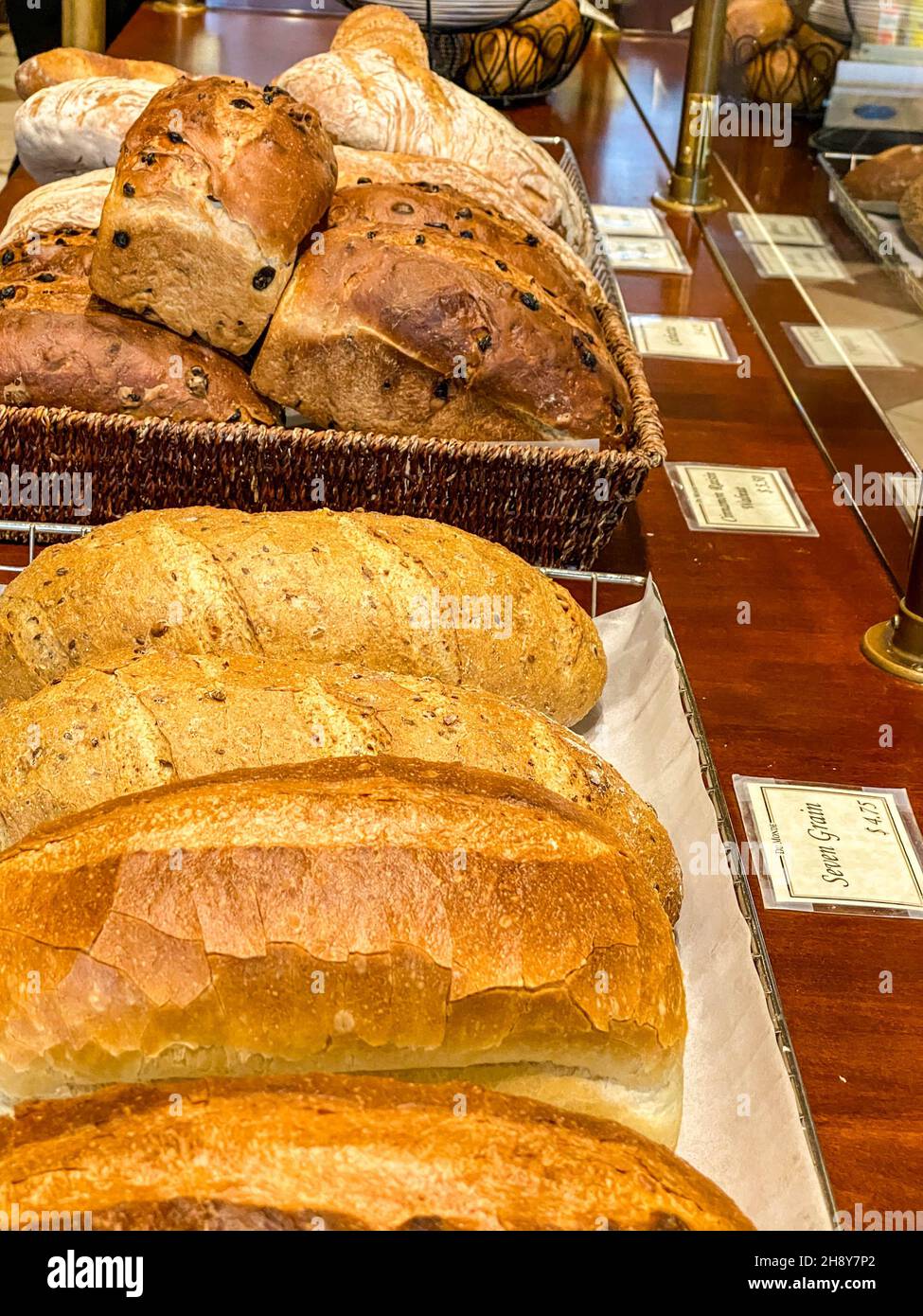 Fresh baked bread on display in bakery Stock Photo - Alamy