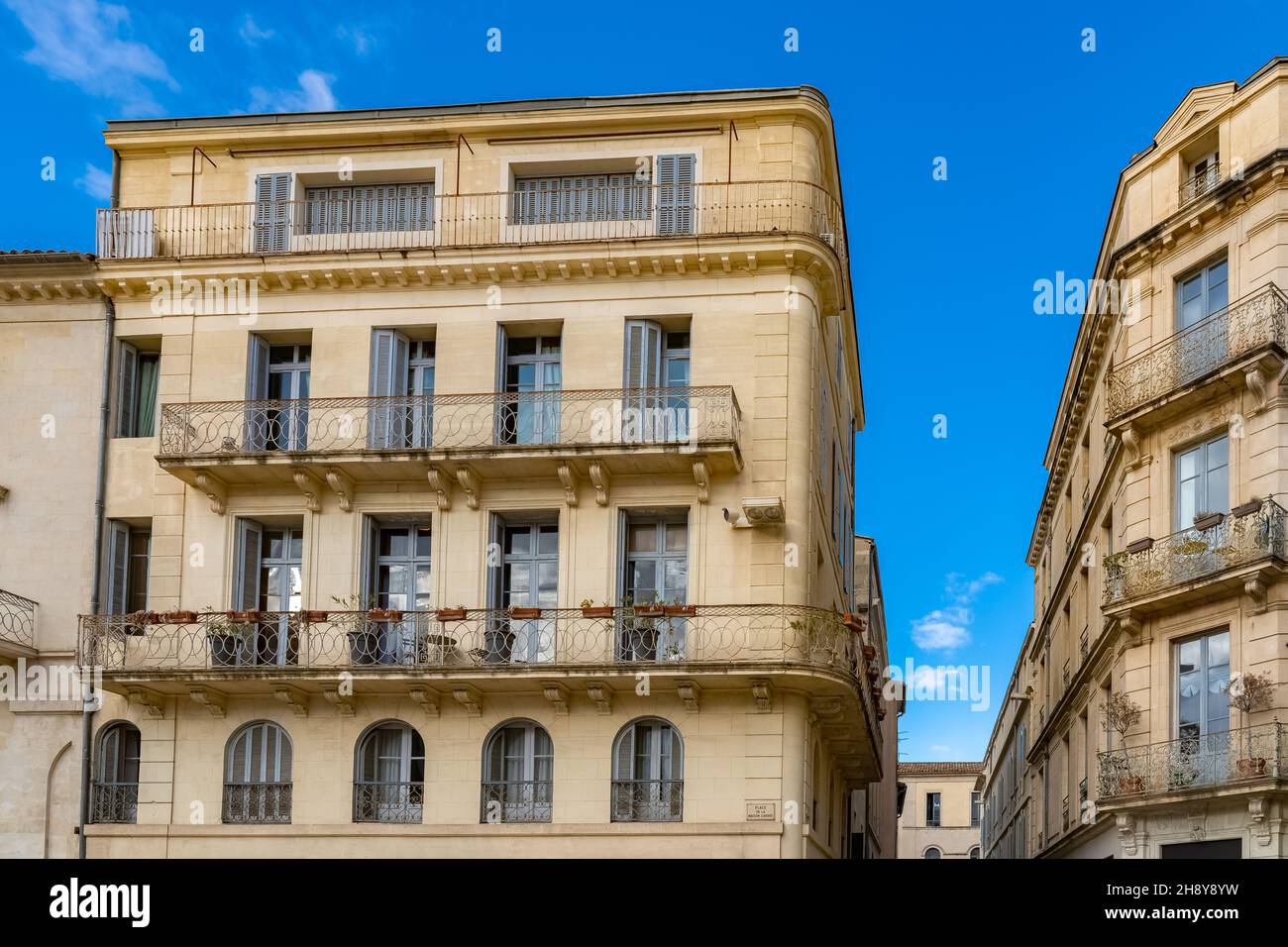 Nimes in France, old facades in the historic center, typical buildings ...