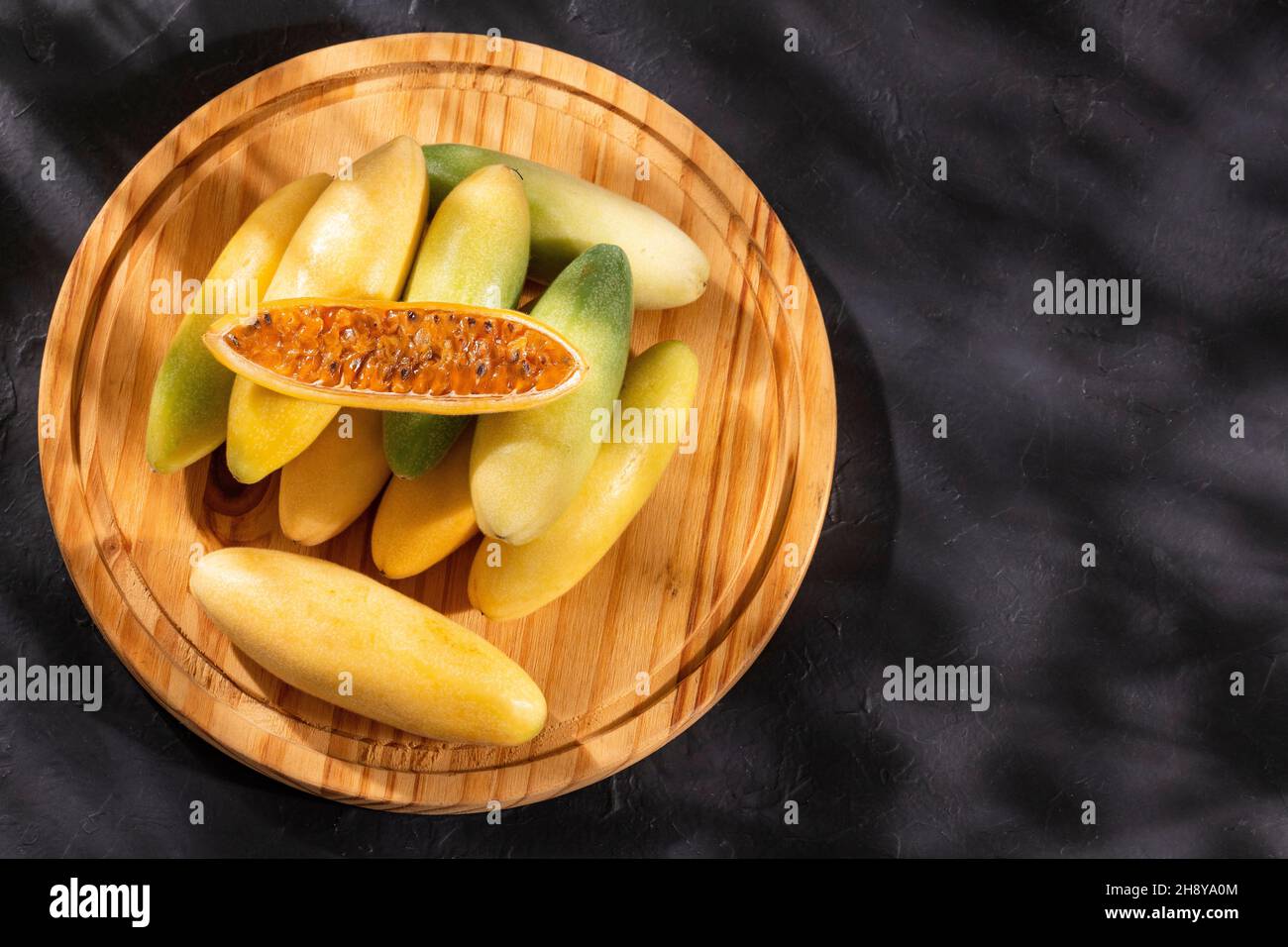 Exotic tropical organic curuba - Passiflora tripartita Stock Photo - Alamy