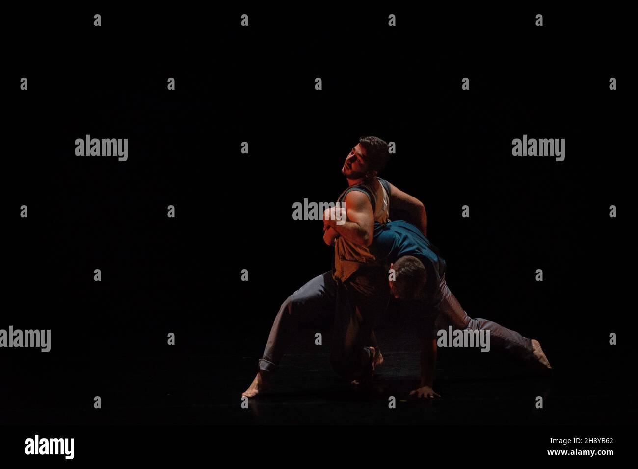 High contrast lighting of dancers on stage during dress rehearsal Stock ...