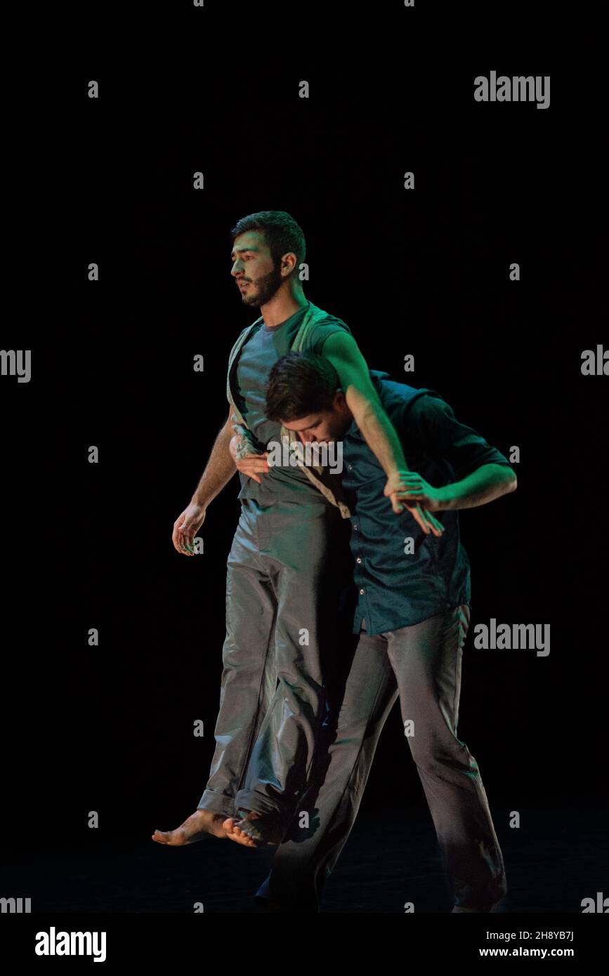 High contrast lighting of dancers on stage during dress rehearsal Stock ...