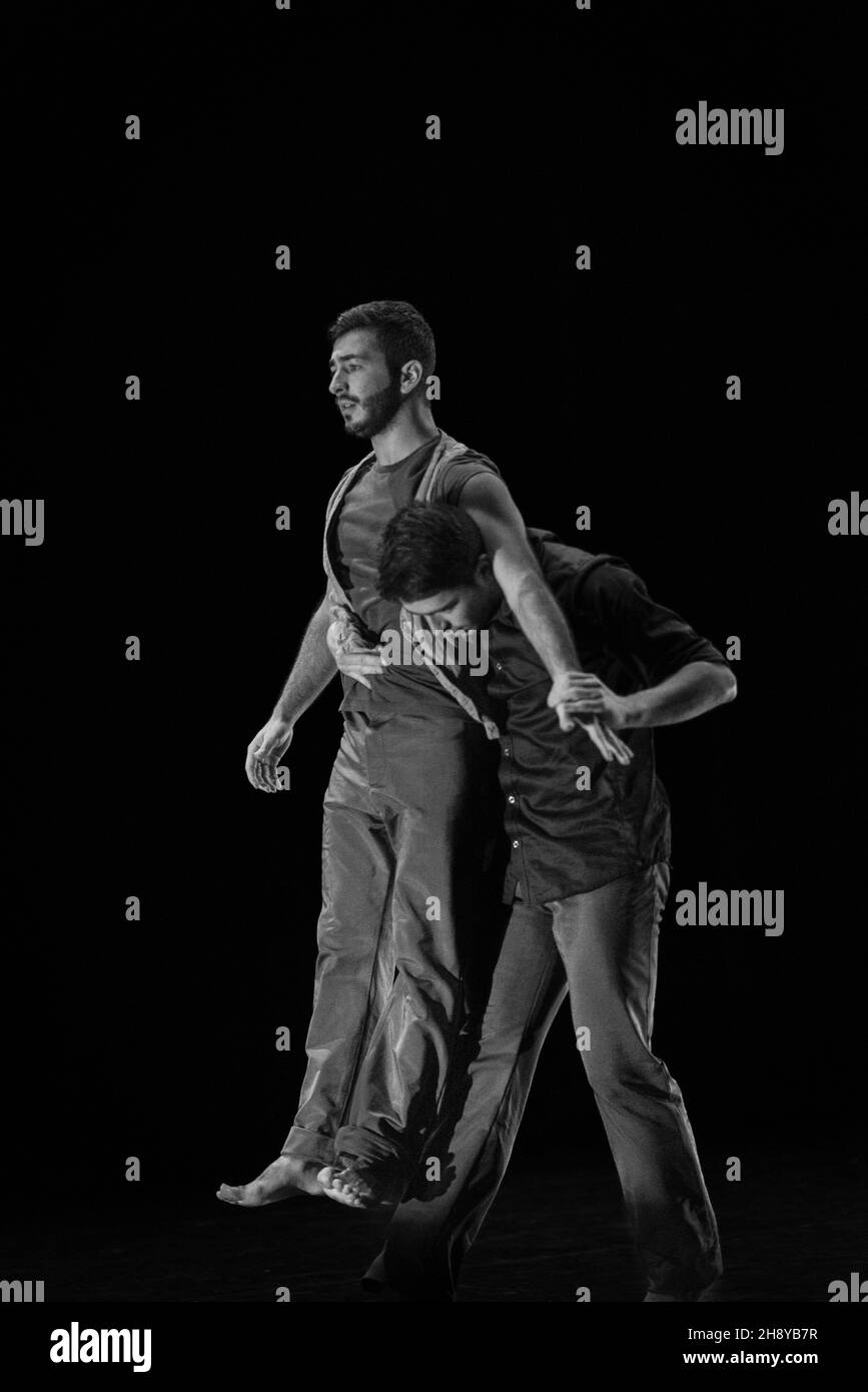 High contrast lighting of dancers on stage during dress rehearsal Stock ...