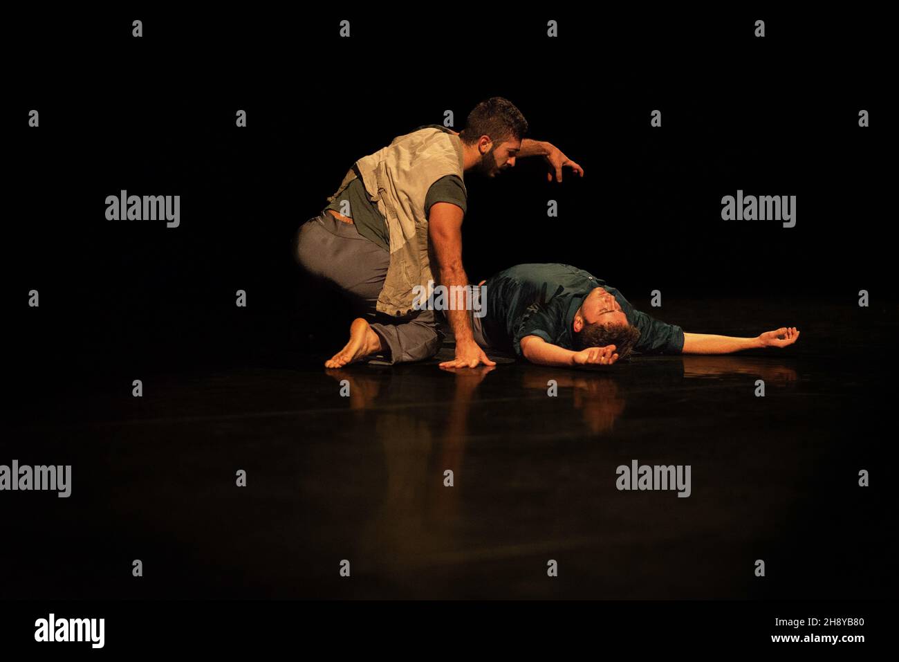 High contrast lighting of dancers on stage during dress rehearsal Stock ...