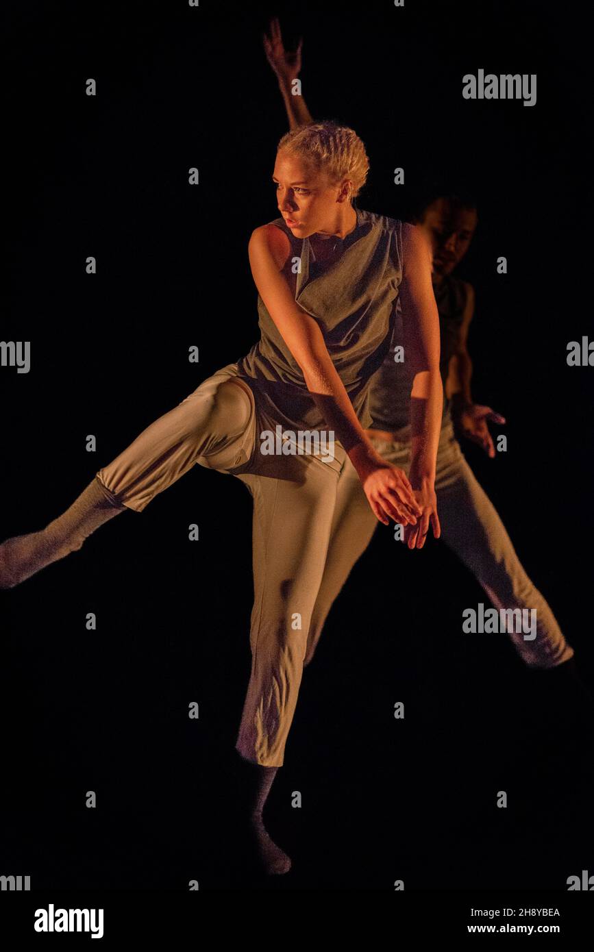 High contrast lighting of dancers on stage during dress rehearsal Stock ...