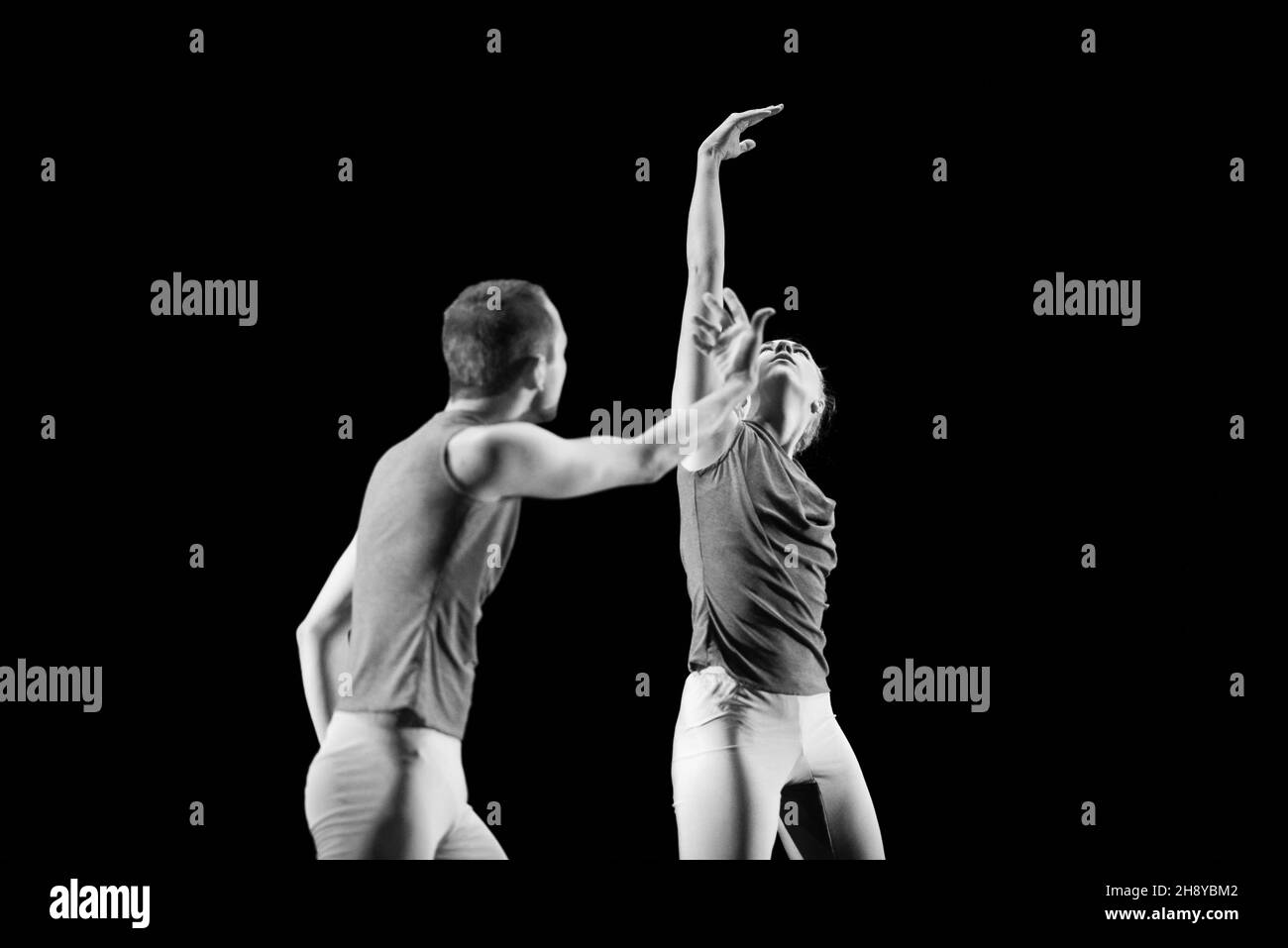 High contrast lighting of dancers on stage during dress rehearsal Stock ...