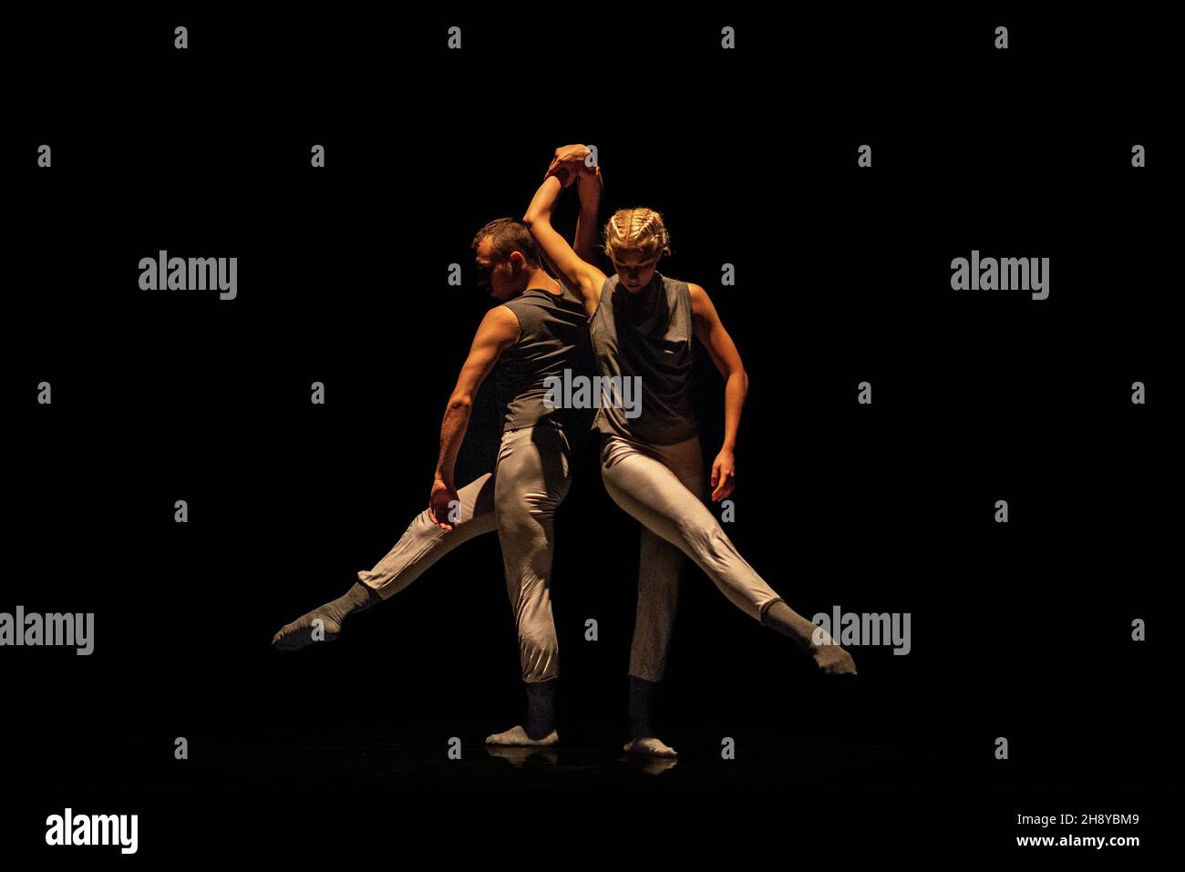High contrast lighting of dancers on stage during dress rehearsal Stock ...