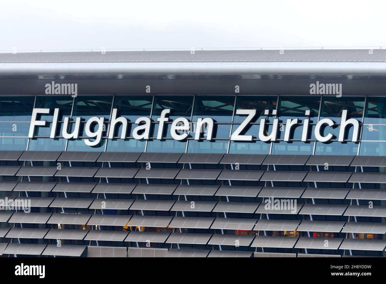 Sign of Zurich Airport (Flughafen Zurich) on the airport facade ...