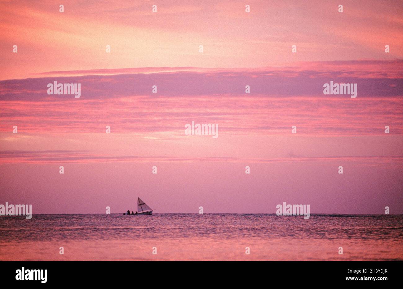 Fishing vessel at sunset off Pereybere on the Northern tip of Mauritius ...