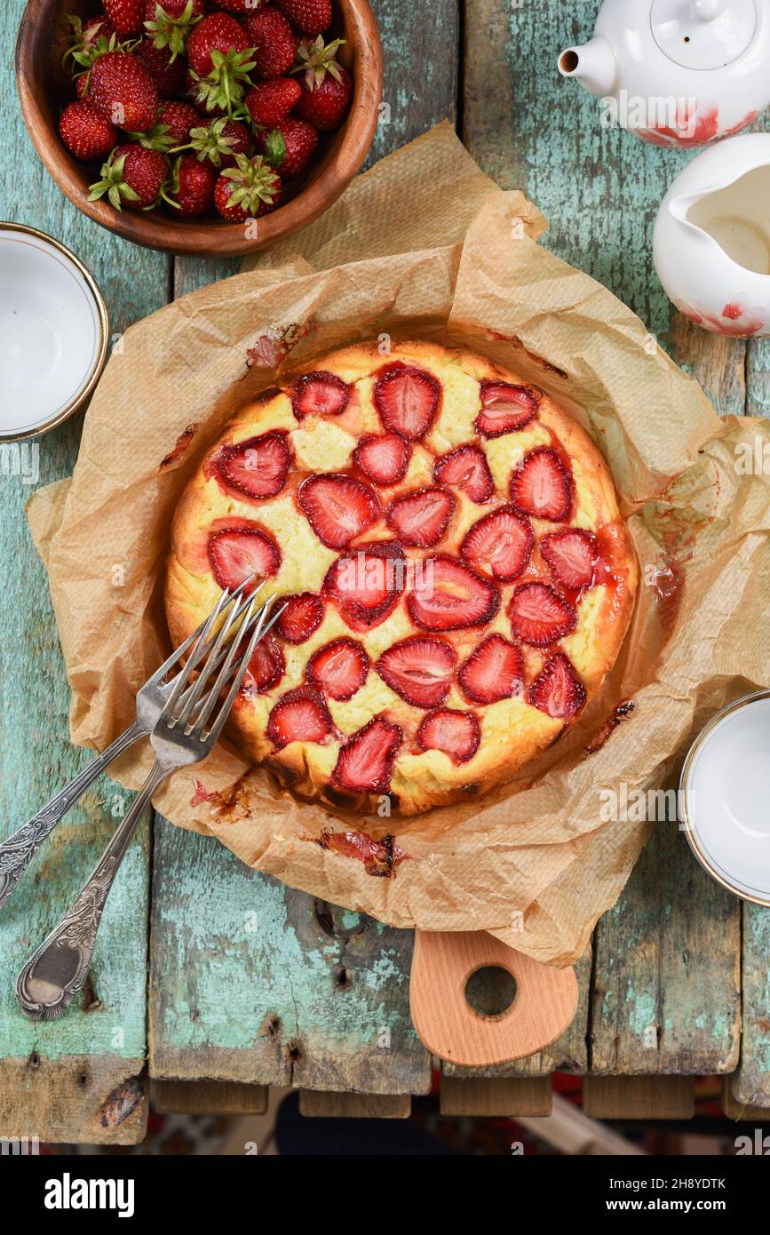 Homemade strawberry pie in baking paper with vintage forks vertical ...