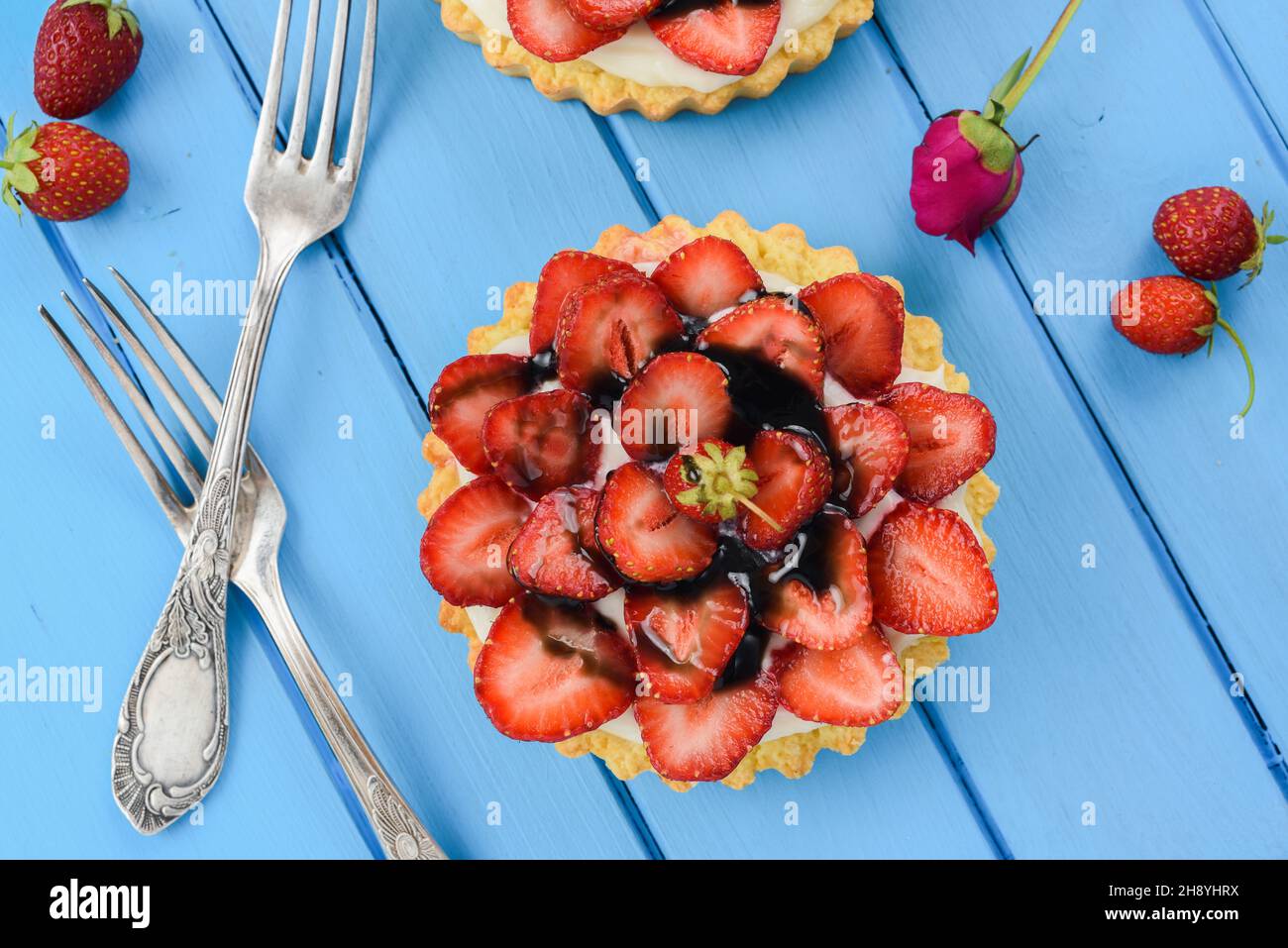 Strawberry tart with mascarpone and licorice syrup served with vintage ...