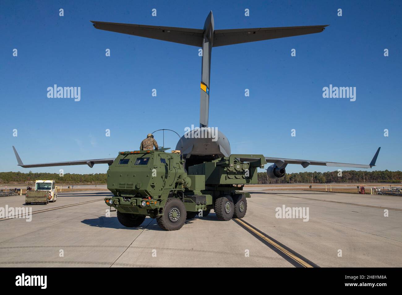U.S. Marines with Combat Logistics Company (CLC) 21 drive an M142 High ...