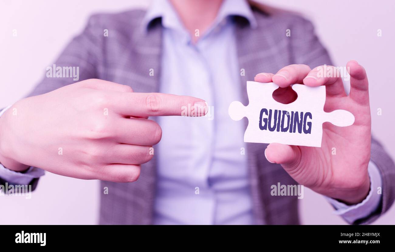 Sign displaying Guiding. Business overview to show someone how to do ...