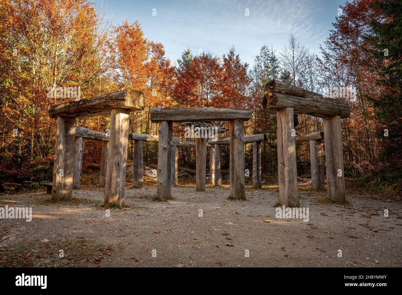 Wooden monument in the colorful autumn forest Stock Photo - Alamy