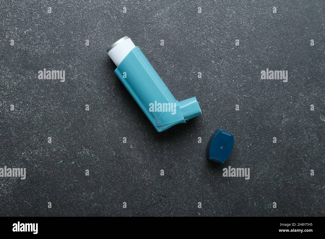 Asthma inhaler on dark background Stock Photo - Alamy