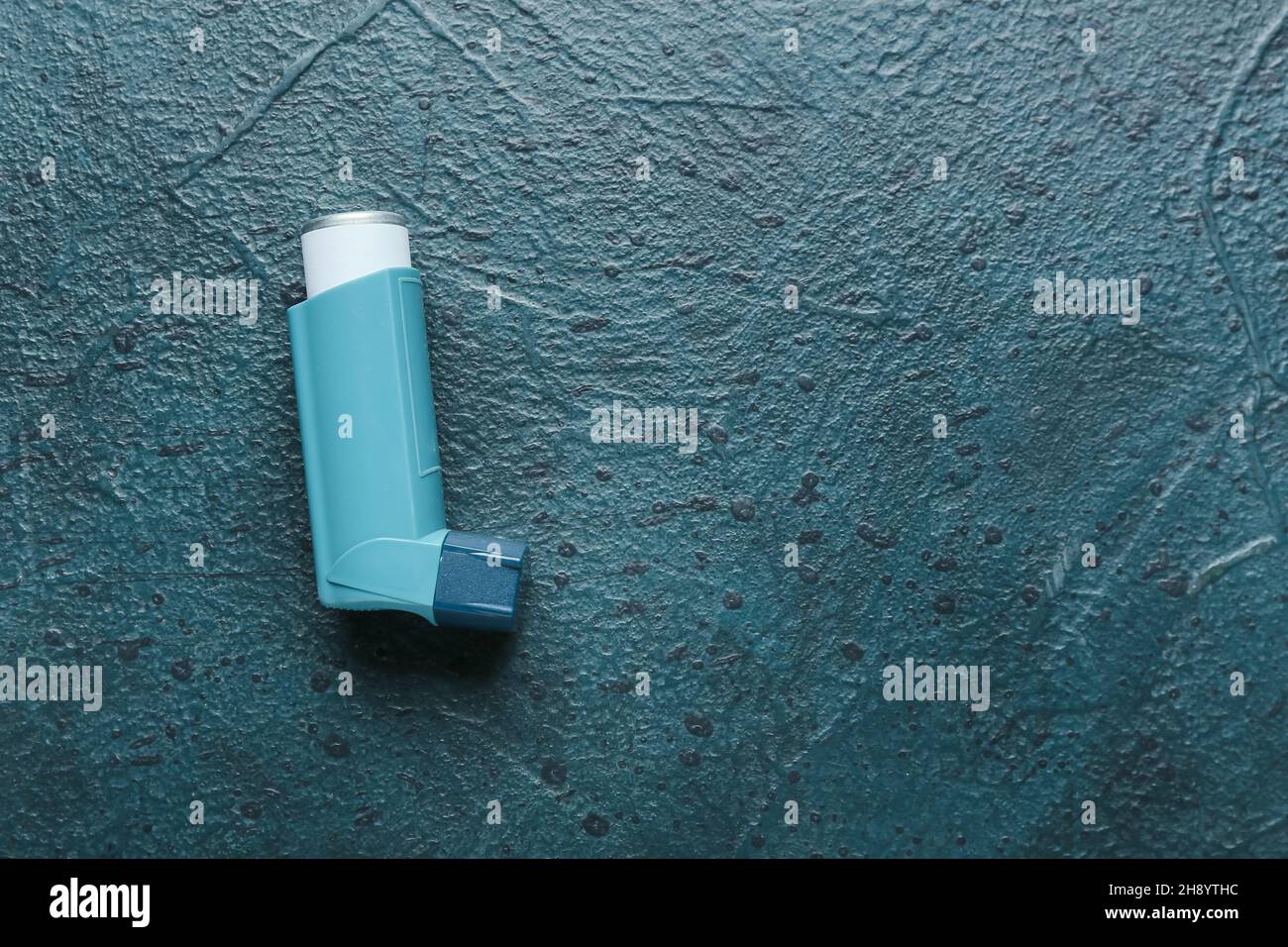 Asthma inhaler on dark background Stock Photo - Alamy