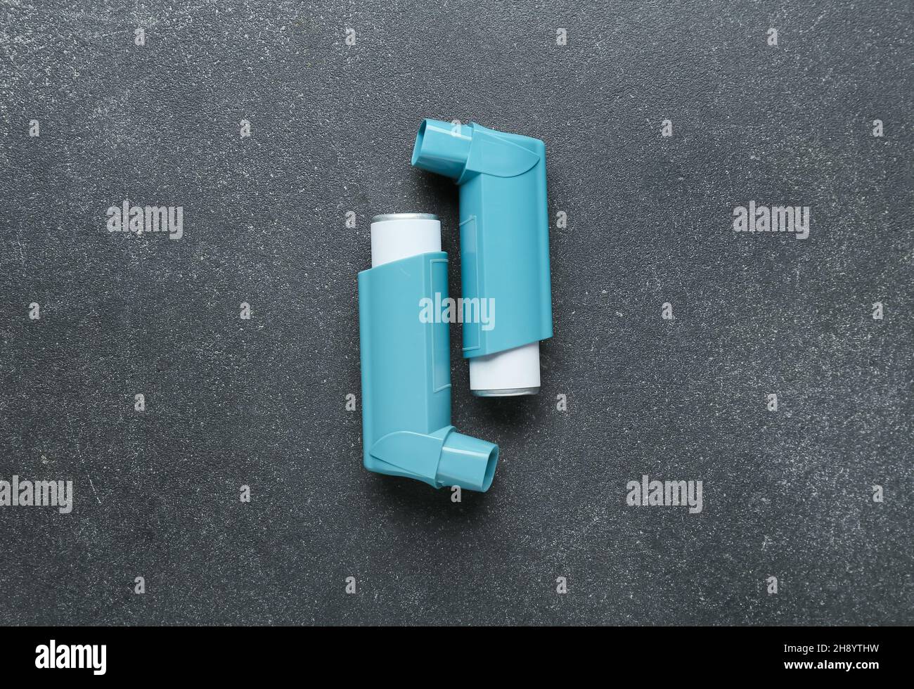 Asthma inhalers on dark background Stock Photo - Alamy