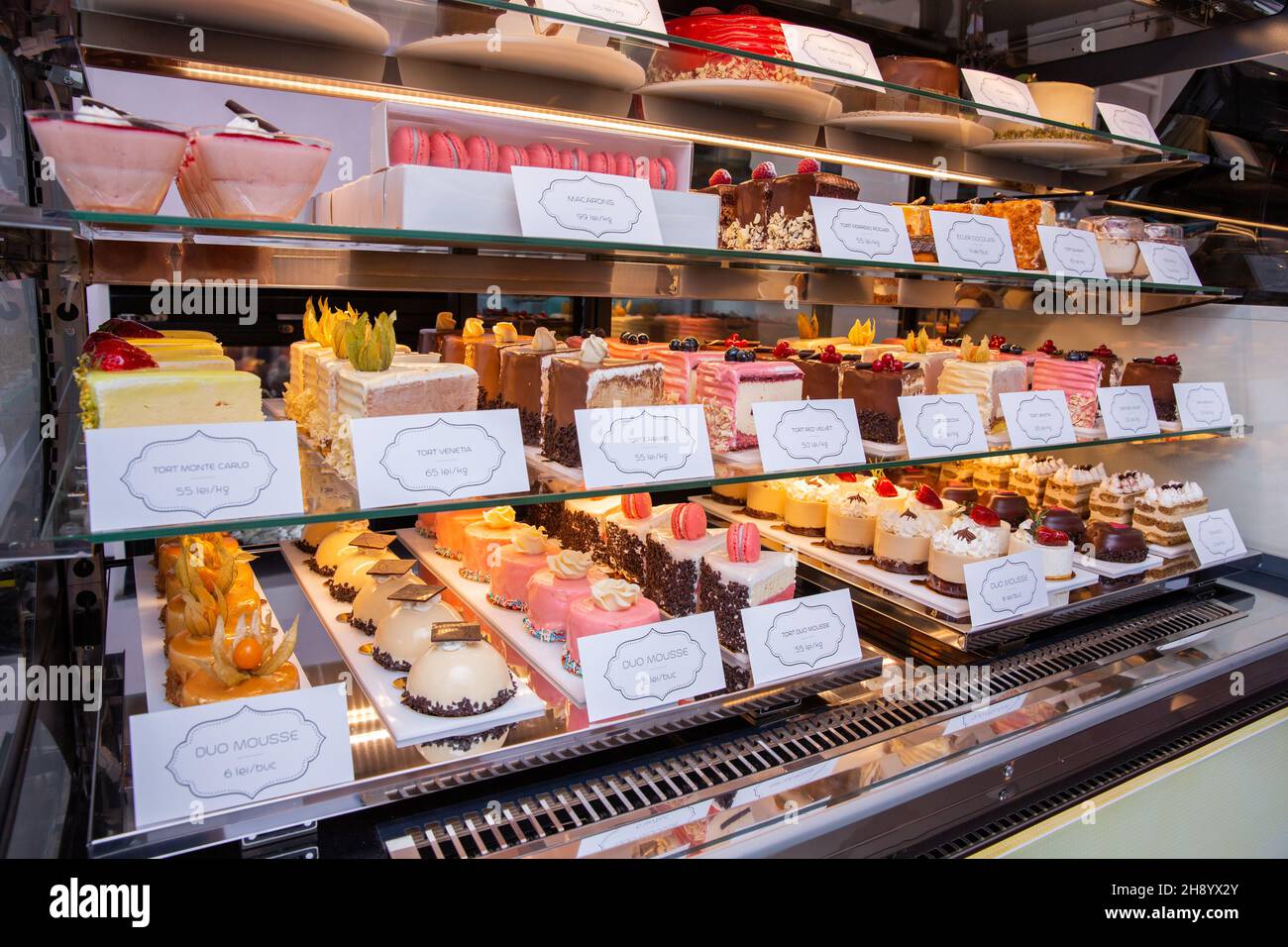 SUCEAVA, ROMANIA - Jul 01, 2018: The different cakes with price tags in ...