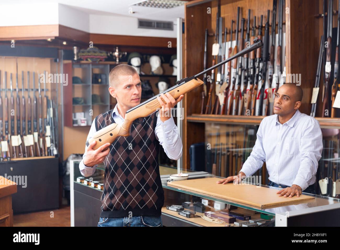 Man rifle barrel indoors hi-res stock photography and images - Alamy