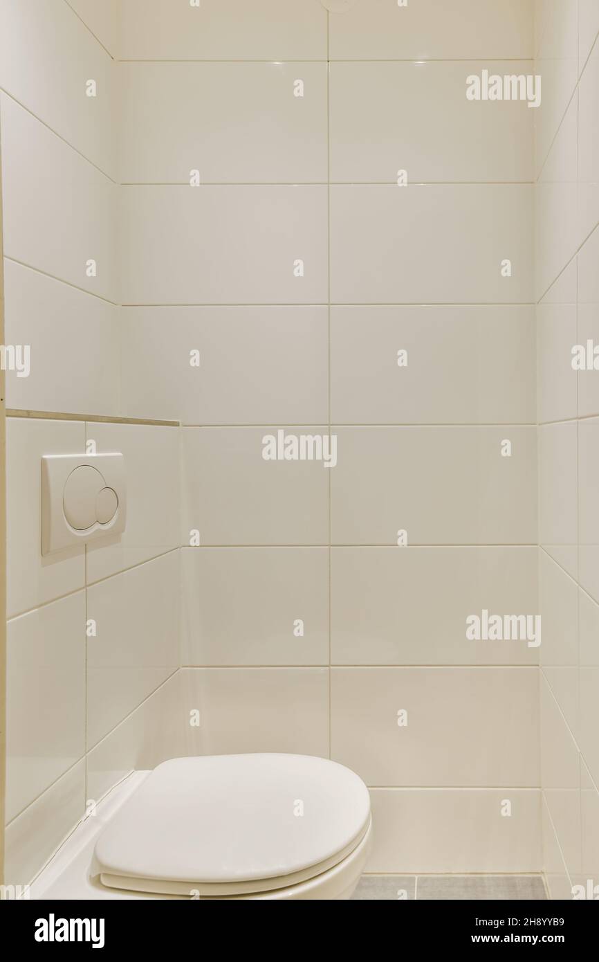 Breathtaking snow white restroom with modern toilet Stock Photo - Alamy