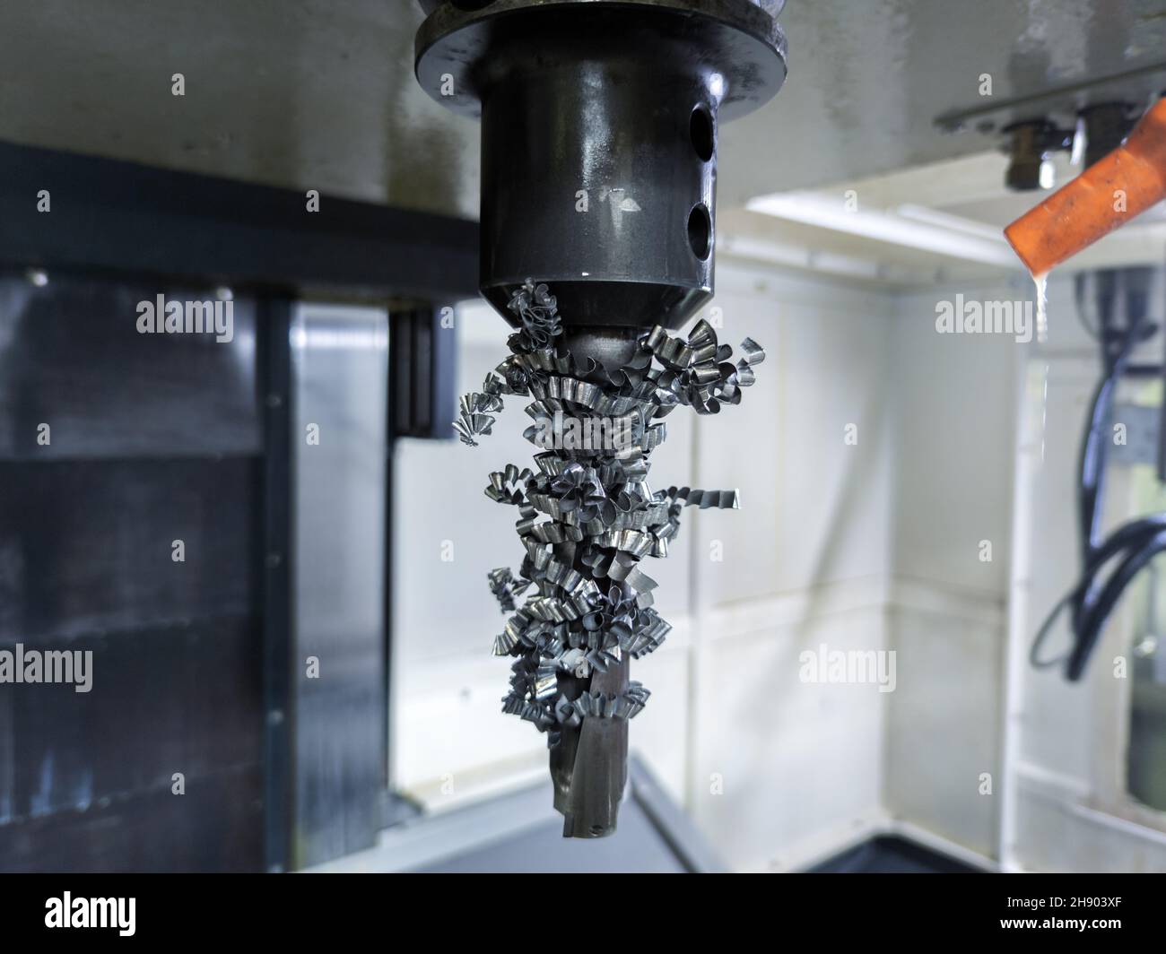 large indexing carbide drill wrapped with long steel swarf stopped in ...