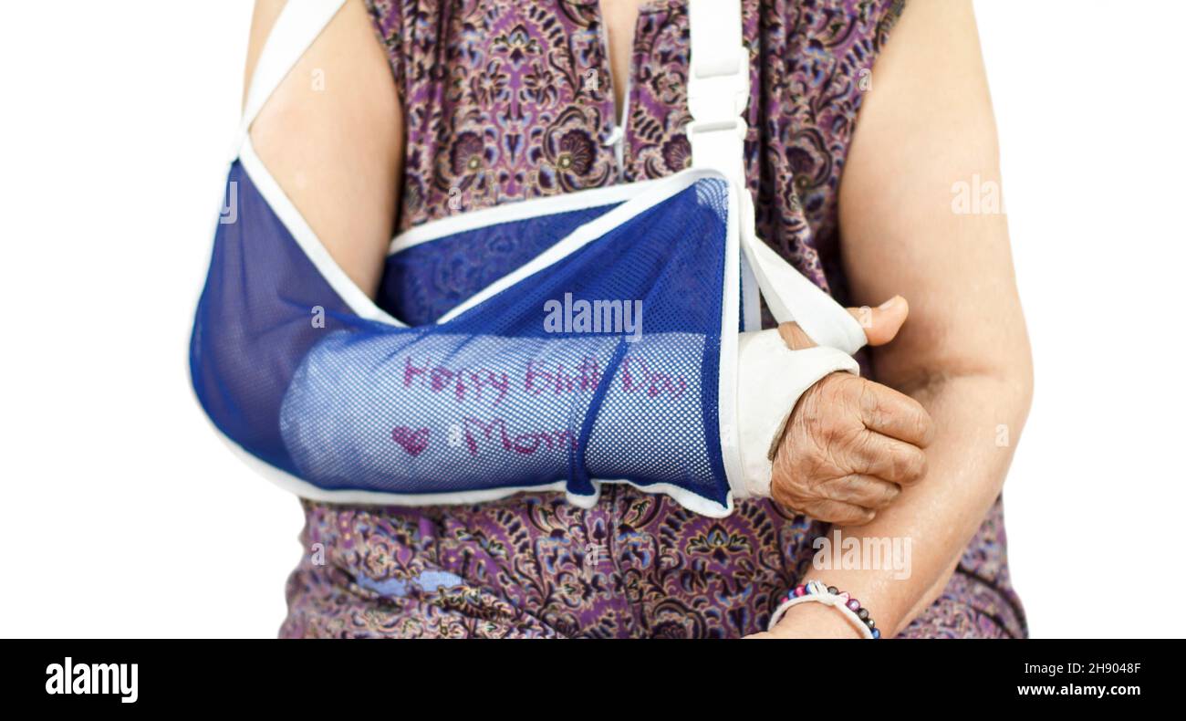 Happy birthday elderly woman with a broken arm on a plaster cast Stock ...
