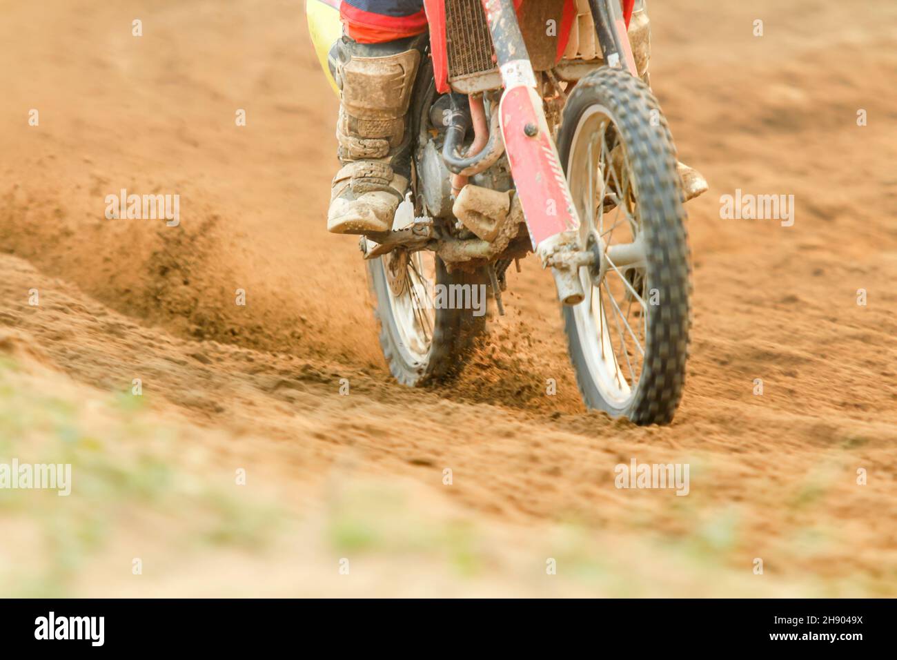 motocross racer accelerating speed in track Stock Photo - Alamy