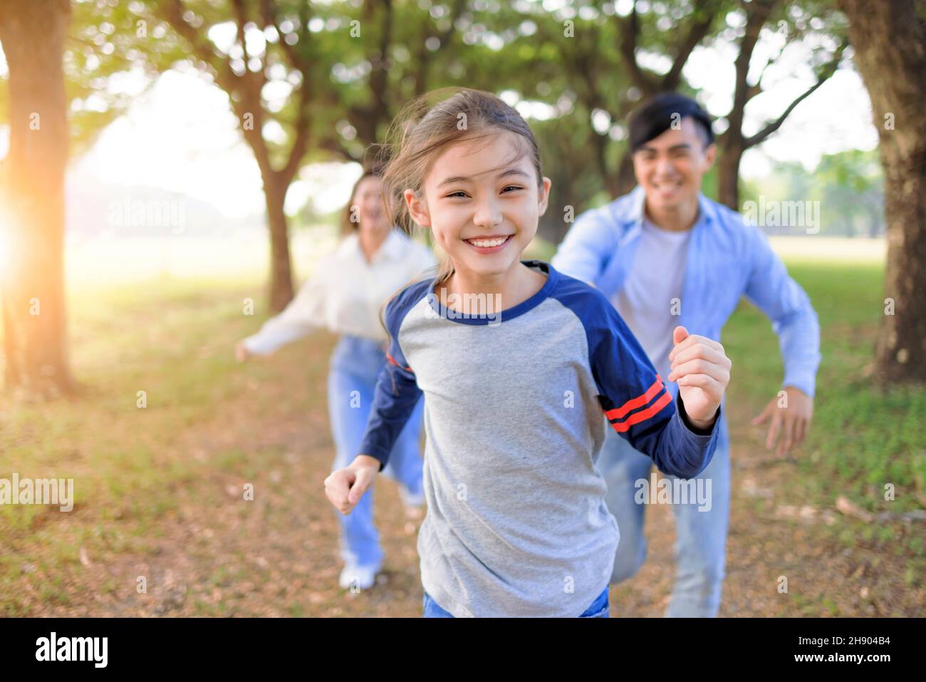 Happy family run hi-res stock photography and images - Alamy