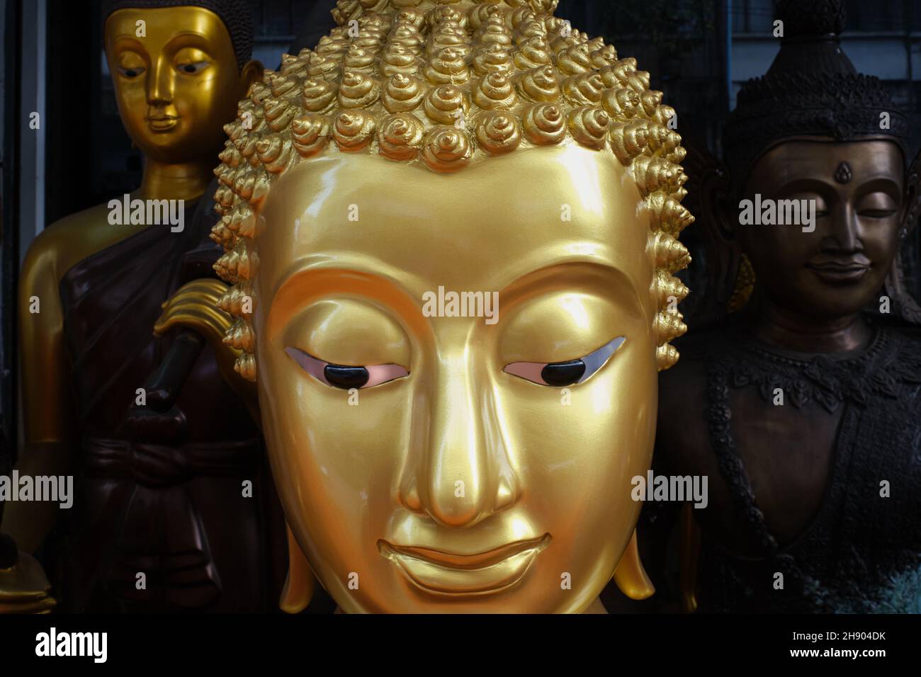 Buddha statues at a factory for Buddhist objects in Bamrung Muang Rd ...
