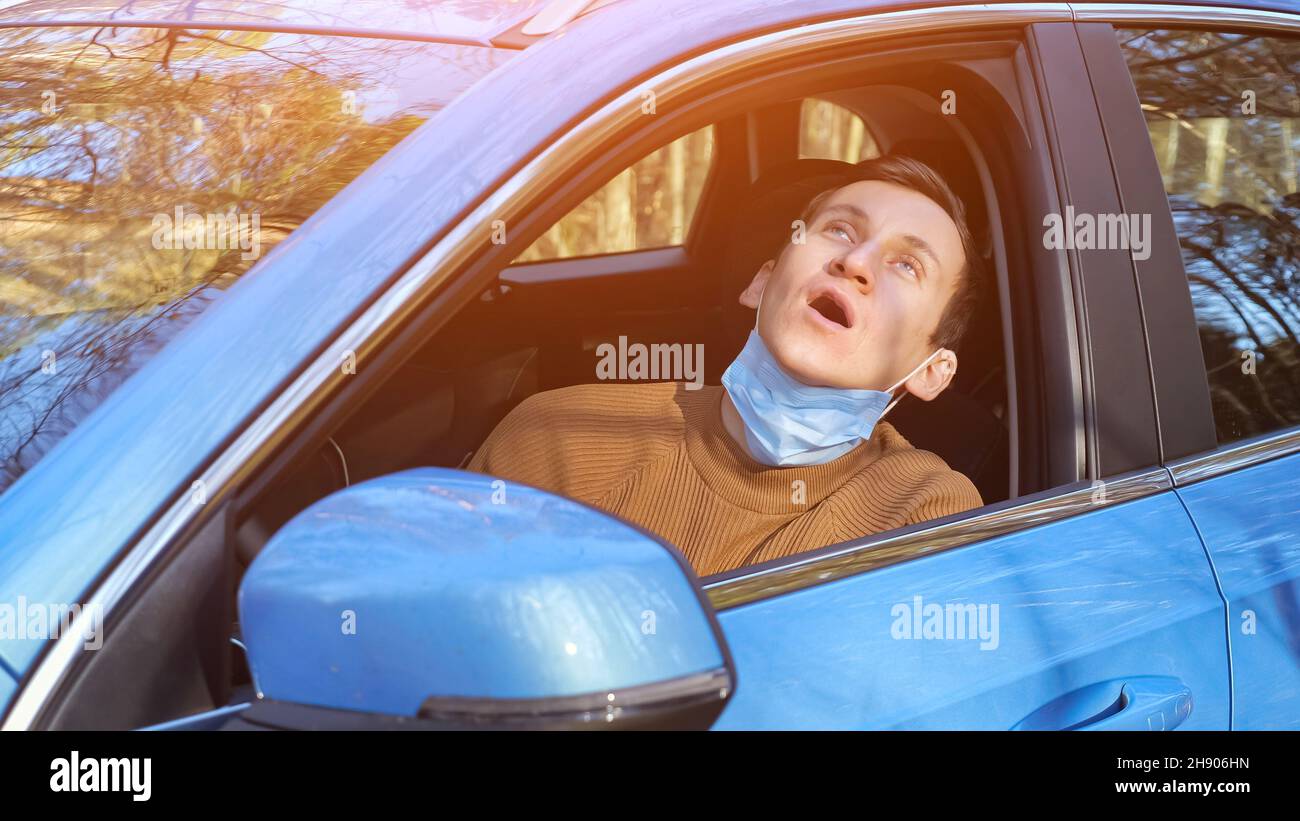 Man opens window and takes off medical mask waiting for help Stock ...