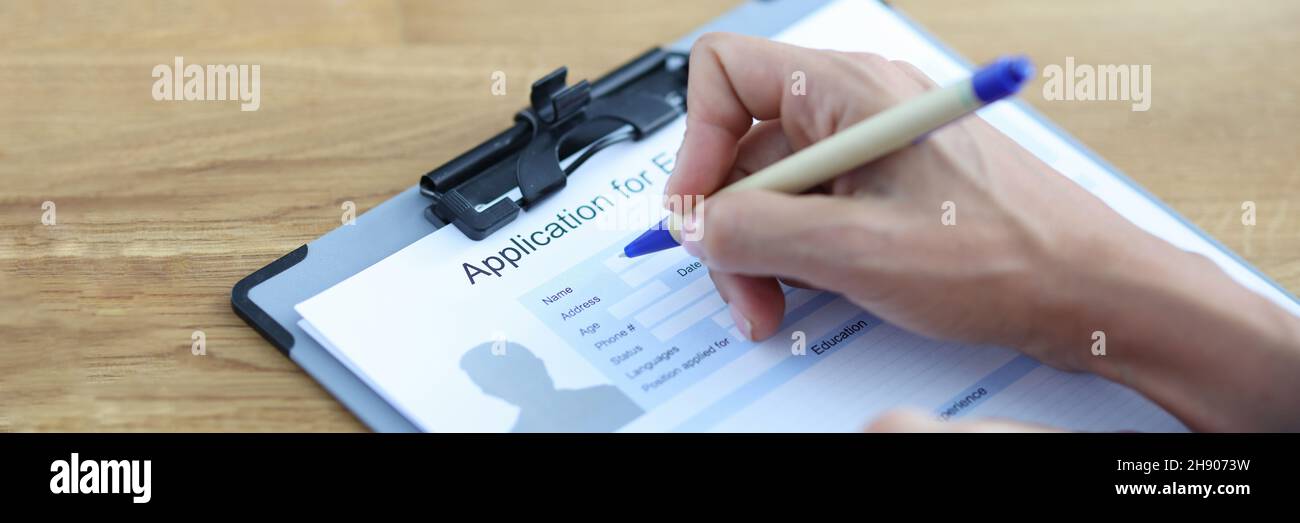 Woman filling out documents for employment with ballpoint pen closeup ...