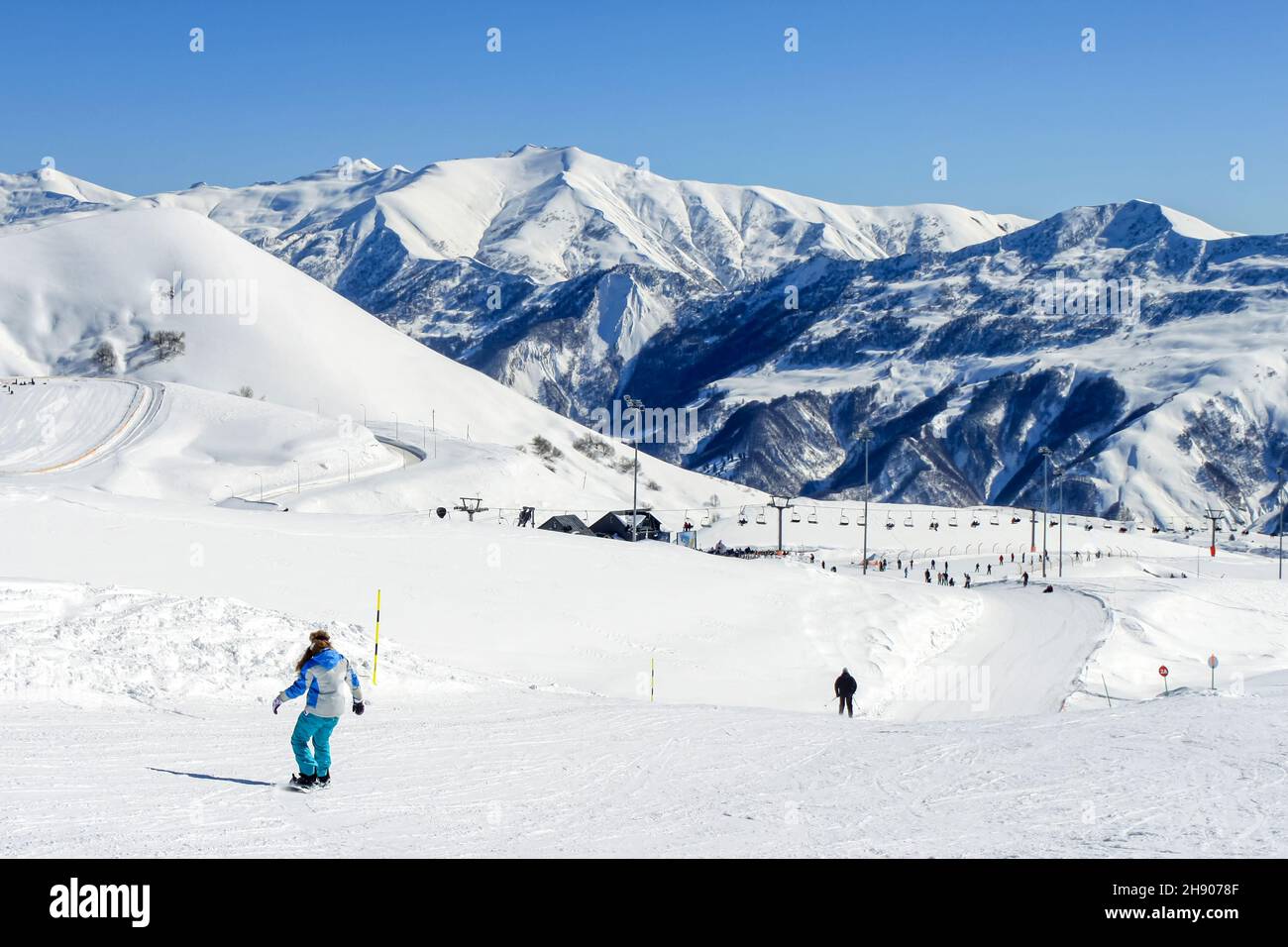 Skier slides down snowy slope hi-res stock photography and images - Alamy