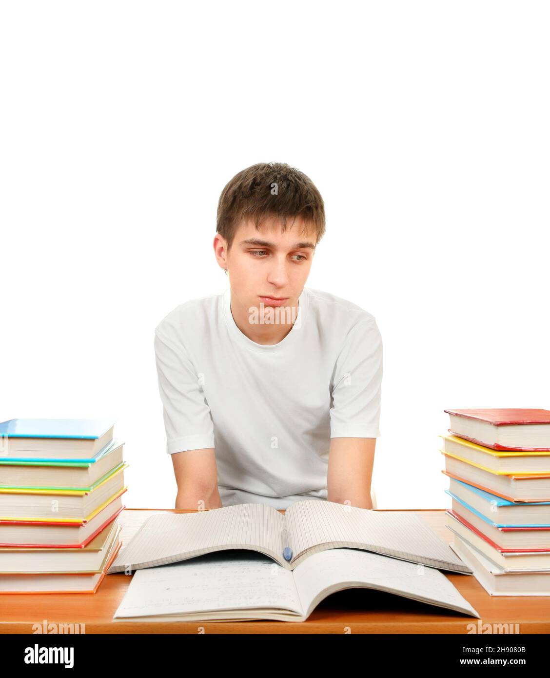Sad and Tired Student at the School Desk on the white background Stock ...