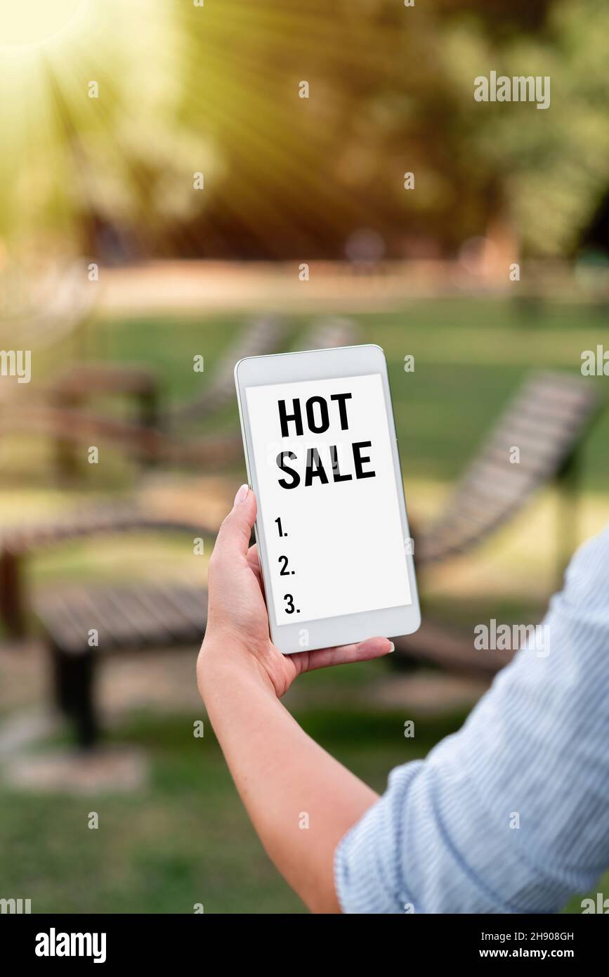 Conceptual caption Hot Sale. Business approach putting products on high ...