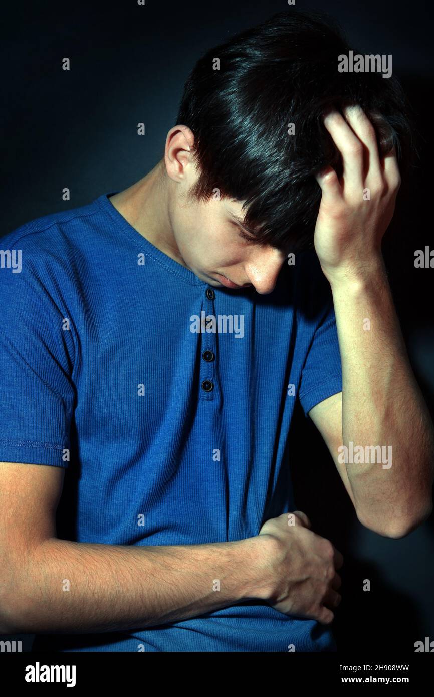Sad man in dark room hi-res stock photography and images - Alamy